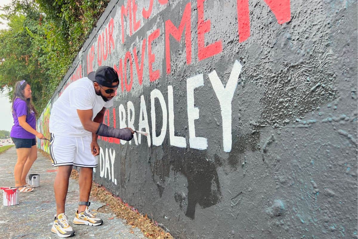 Terrell Bradley, friend paint 34th Street wall—again