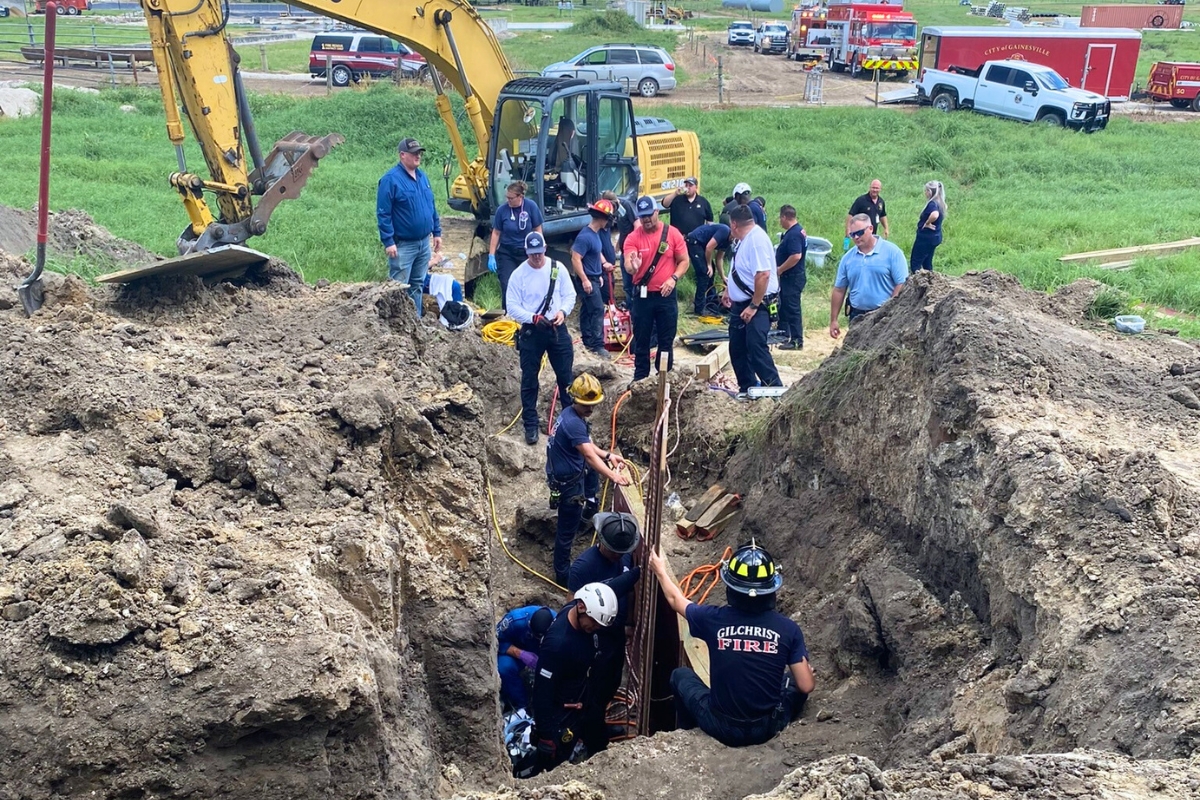 Rescue crews free man from collapsed trench