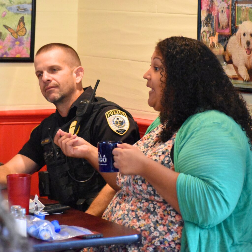 Gainesville Police Department officers sit down to coffee with citizens